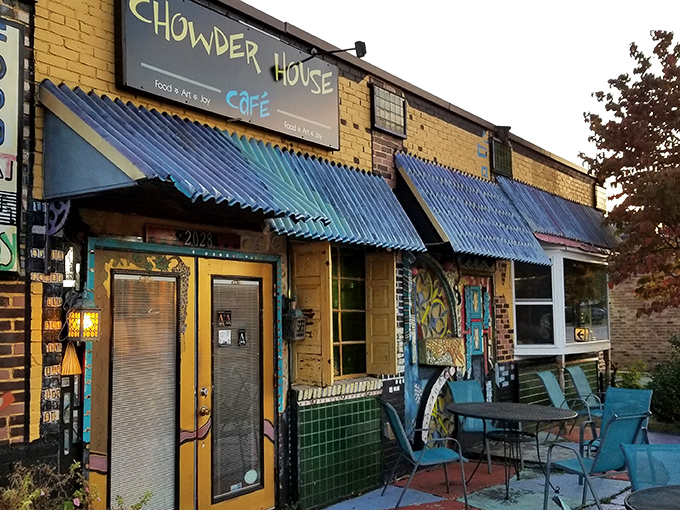 The yellow brick exterior with vibrant blue awnings feels like stumbling upon a secret coastal gem that somehow landed in Akron's Merriman Valley.