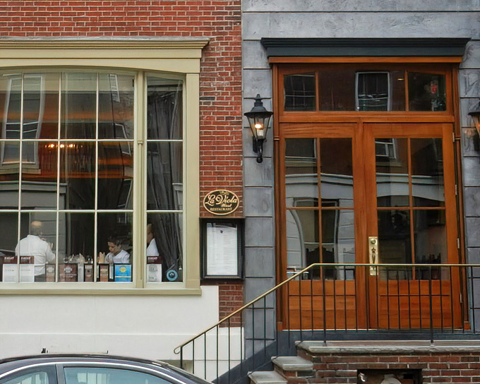 La Viola's elegant storefront blends seamlessly into Philadelphia's historic architecture, promising Italian treasures behind those wooden doors.