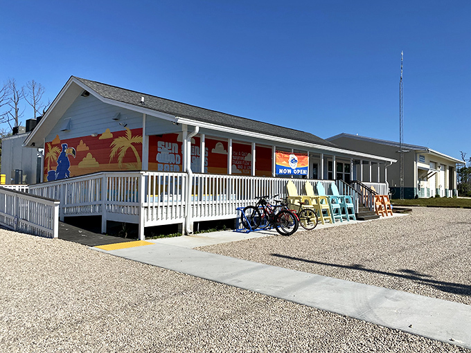The quintessential Florida seafood shack dream &ndash; pale blue siding, white porch railings, and the promise of Gulf treasures within. Beach bikes parked outside suggest the perfect post-swim meal spot.