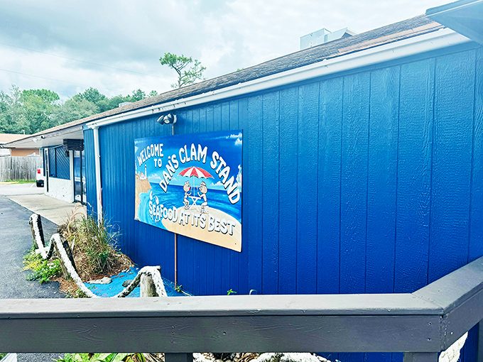 The bright blue exterior of Dan's Clam Stand stands out like a seafood beacon, promising treasures from the deep that'll make your taste buds dance. 