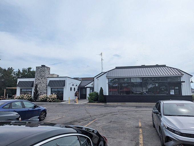 The unassuming exterior of Jolly Rogers Seafood House stands like a beacon for hungry travelers, promising Lake Erie's finest treasures within those white walls.