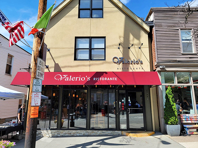 The charming facade of Valerio's, where that modest red awning serves as Cleveland's culinary bat signal for pasta lovers seeking the extraordinary.