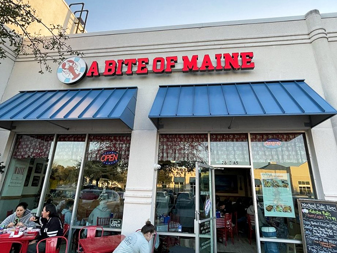 The bright red sign of A Bite of Maine stands out like a lighthouse beacon, guiding hungry seafood lovers to this coastal oasis in Virginia Beach.
