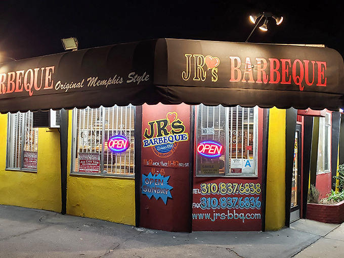 By night, JR's neon glow acts like a tractor beam for BBQ lovers. The security bars can't contain the aromatic secrets smoking inside.