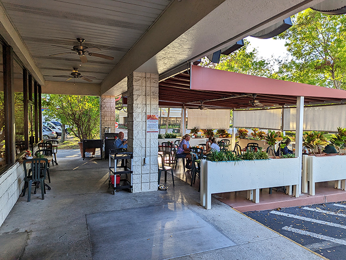 The unassuming exterior of Skillets belies the breakfast magic happening inside. Florida sunshine and outdoor seating create the perfect morning backdrop.