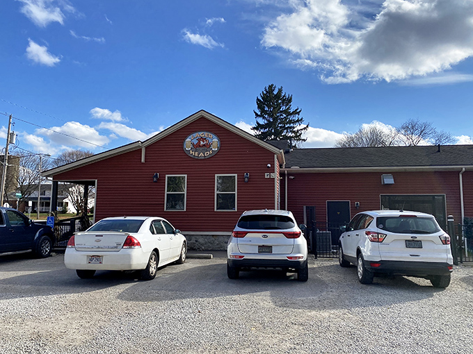 The red barn-like exterior of Lager Heads stands like a beacon of barbecue hope along the Medina roadside, promising smoky treasures within.