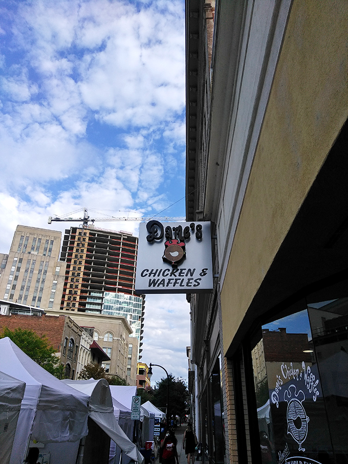 The iconic Dame's sign stands proudly against Durham's skyline, like a beacon calling hungry souls to chicken-and-waffle paradise.