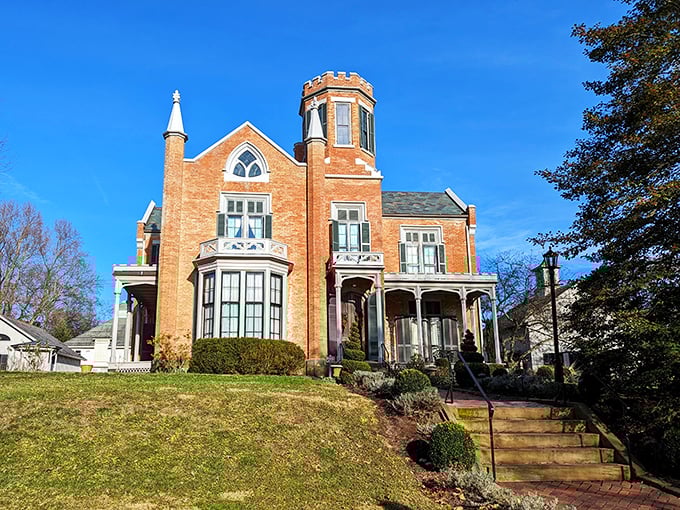 The red brick fa&ccedil;ade and distinctive tower of The Castle stand proudly behind wrought iron fencing, like a Victorian dream that somehow materialized in small-town Ohio.