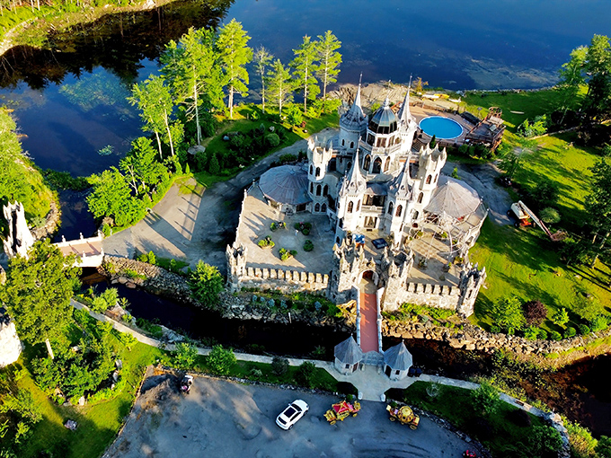 An aerial dream come true! Chris Mark Castle rises from Connecticut's woodlands like a medieval mirage, complete with turrets, spires, and that jaw-dropping circular terrace.