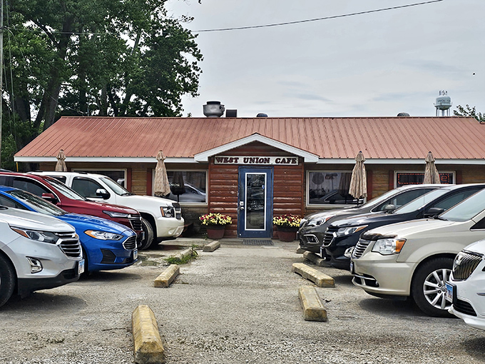 The rustic log cabin exterior of West Union Cafe welcomes hungry travelers with its bright blue door and cheerful yellow mums&mdash;rural Illinois' version of a culinary red carpet.