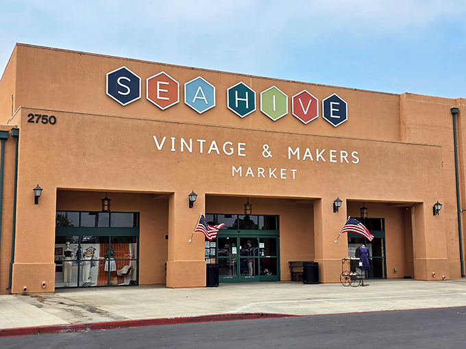 The terracotta-colored exterior of Sea Hive Station welcomes treasure hunters with its distinctive hexagonal logo and promise of vintage wonders within.