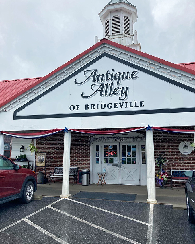 The iconic red-roofed building with its distinctive white cupola stands like a beacon for treasure hunters traveling through Bridgeville.