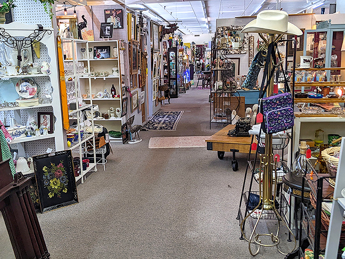 The pink awning and turquoise doors of Village Antique Mall beckon like a siren song to treasure hunters. Those gargoyle sentinels aren't just for show&mdash;they're guarding vintage gold!