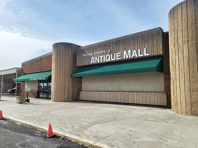 The unassuming exterior of Heritage Square Antique Mall hides a universe of treasures within, like a time-travel portal disguised as a strip mall storefront.