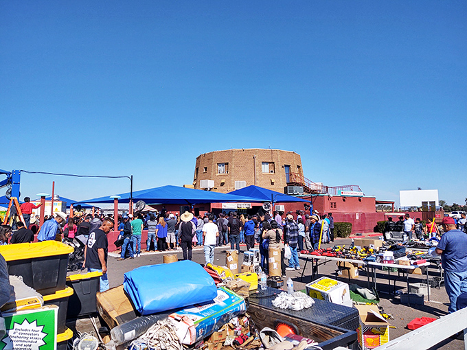 The distinctive round building serves as the market's landmark, standing like a desert fortress amid a sea of colorful vendor tents and treasure hunters.