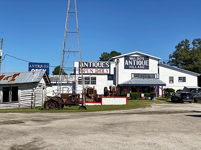 The white-washed charm of Waldo's Antique Village stands like a time machine in the Florida sun, complete with vintage farm equipment as lawn ornaments.