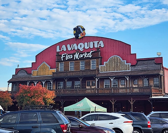 The iconic red barn facade of La Vaquita stands like a beacon for bargain hunters, promising treasures within its Western-styled walls.