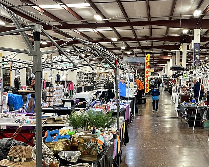 Endless aisles of possibility stretch through Tupelo Flea Market, where treasure hunters navigate a wonderland of potential bargains.