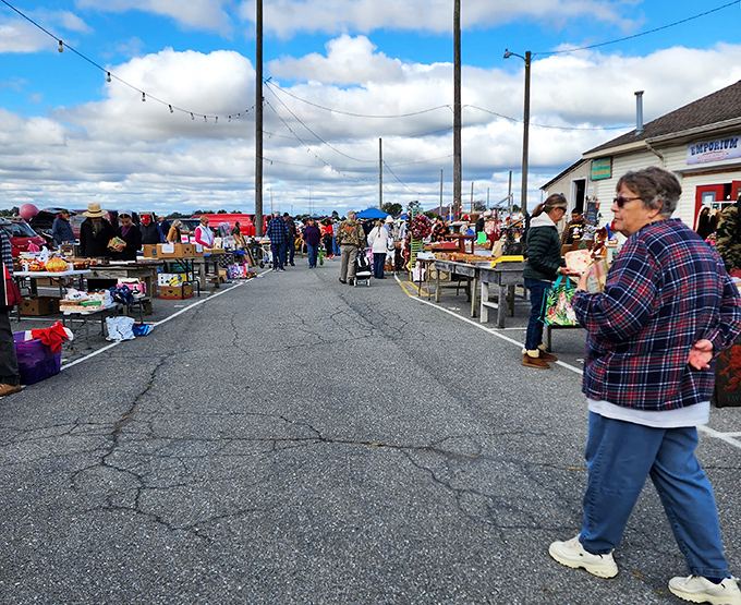 Treasure hunters navigate the bustling outdoor aisles at Root's, where one person's castoffs become another's prized possessions.