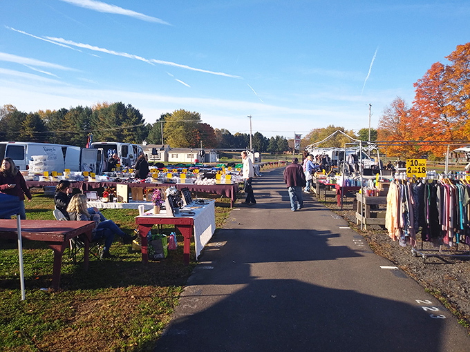 Morning sunshine illuminates rows of treasures at Rice's Market, where early birds and bargain hunters converge in a ritual as Pennsylvania as shoofly pie.