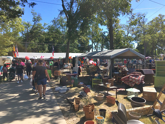 Treasure hunters navigate the sprawling pathways of First Monday Trade Days, where one person's castoffs become another's prized possessions.