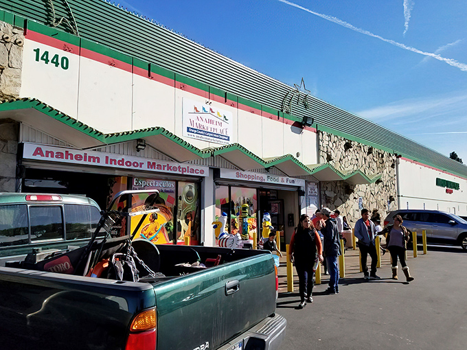 The iconic exterior of Anaheim Marketplace welcomes shoppers with its distinctive green and red trim&mdash;a hint at the cultural fusion waiting inside.