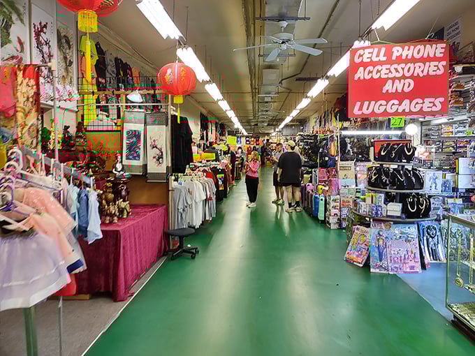 The iconic green-floored corridors of Main Gate Flea Market stretch before you like a bargain hunter's yellow brick road to retail paradise.