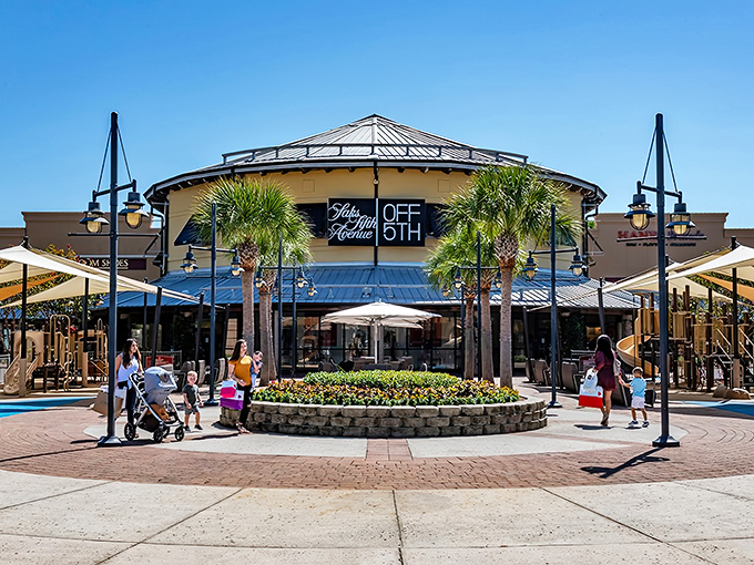 The iconic circular hub of Silver Sands Premium Outlets stands like a retail lighthouse, beckoning shoppers with promises of Saks OFF 5TH treasures and palm-fringed pathways.