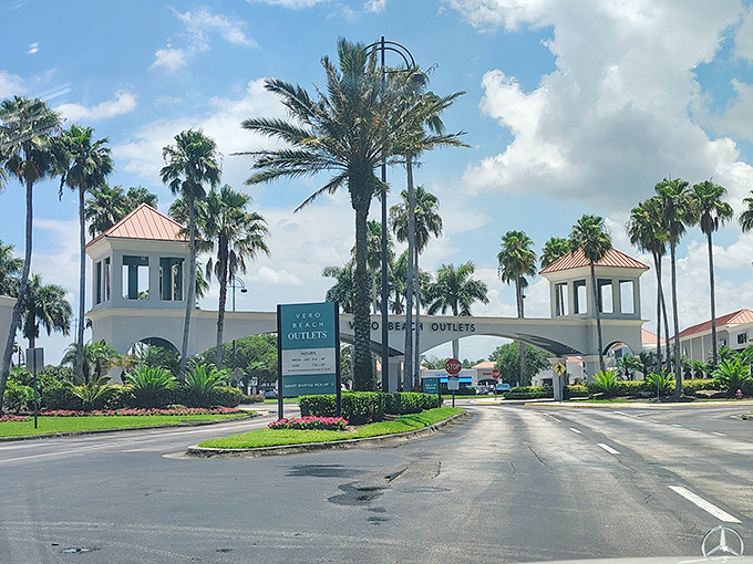 The grand entrance to Vero Beach Outlets welcomes shoppers with swaying palm trees and Mediterranean-inspired architecture &ndash; Florida's version of retail paradise.