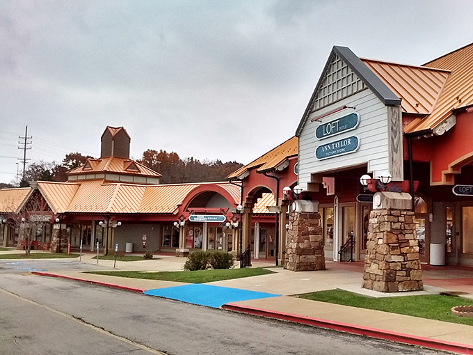 The distinctive terra-cotta roofs of Osage Beach Outlet Marketplace welcome bargain hunters like a retail oasis in the Ozarks landscape.