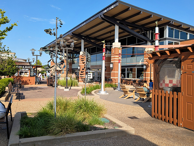 The central courtyard area offers a moment of respite between shopping conquests, complete with whimsical sculptures and comfortable seating for the shopping-weary.