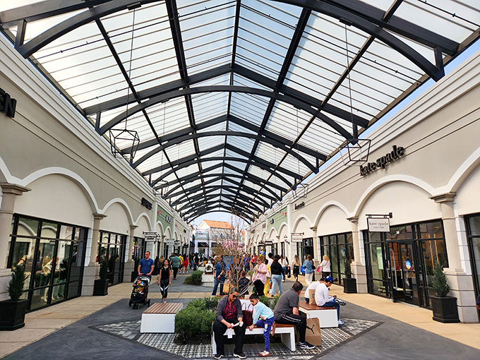 The architectural marvel of Tanger's glass ceiling lets sunshine flood the walkways. Shopping under blue skies without weather worries&mdash;pure genius! 