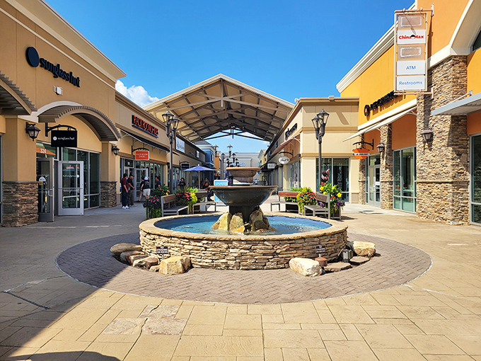 A stone fountain creates a peaceful oasis amid shopping adventures – the perfect spot to contemplate your next purchase.