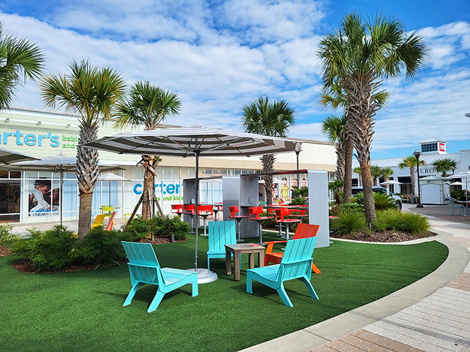 Those teal Adirondack chairs aren't just for show &ndash; they're strategic resting spots for when your shopping bags outweigh your arm strength.