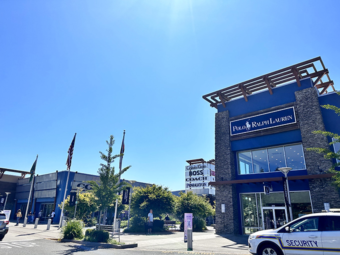 The grand entrance to Seattle Premium Outlets stands like a retail Emerald City, where your wallet might actually thank you afterward. 