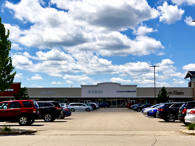 Blue skies and big brands &ndash; the GUESS, ALDO, and Calvin Klein storefronts stand ready for your wallet's workout session.