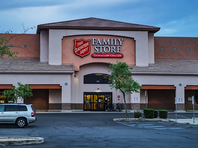 The stucco facade of the Salvation Army Family Store glows warmly at dusk, promising treasures within that await discovery by savvy Phoenix shoppers.