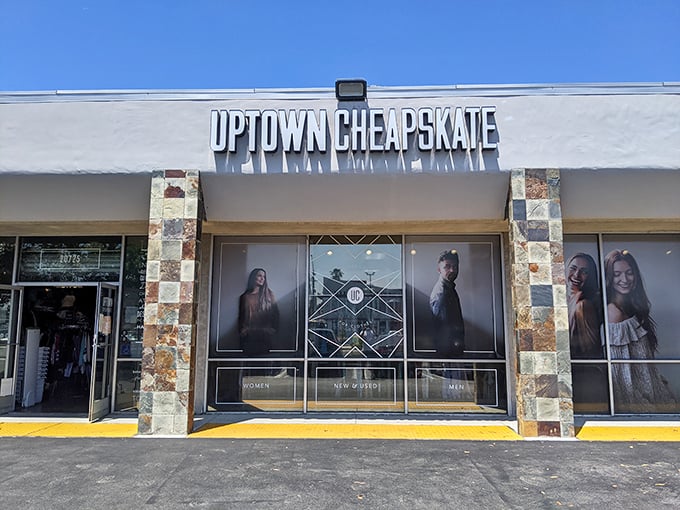 The storefront beckons like a fashion oasis in the suburban desert, promising treasures within those clean white walls and distinctive stone accents.