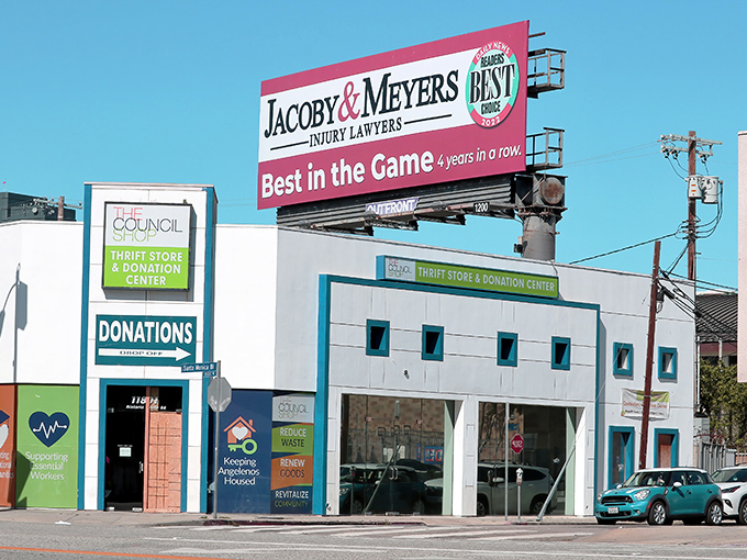 The vibrant blue and white exterior of The Council Shop stands out on Santa Monica Boulevard like a beacon for treasure hunters and bargain enthusiasts alike.