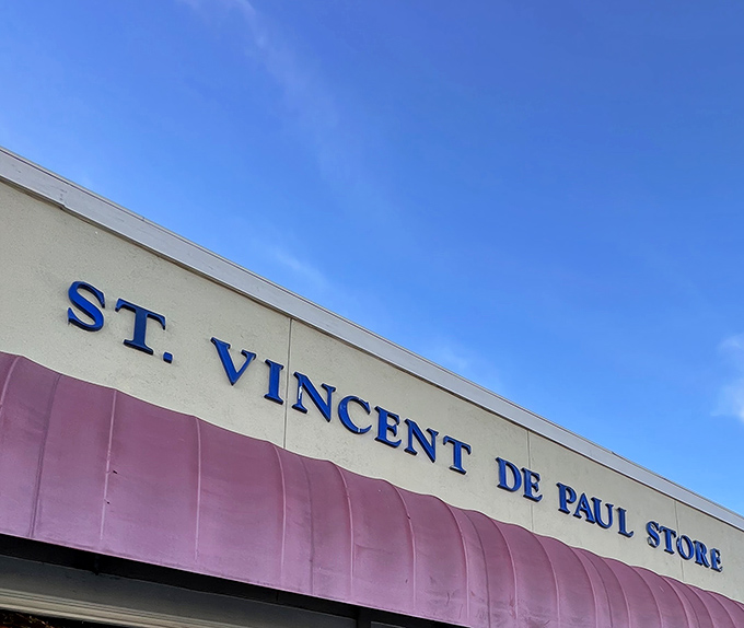 The iconic pink awning and bold blue lettering of St. Vincent de Paul beckons bargain hunters like a thrift store lighthouse on Fremont Boulevard.