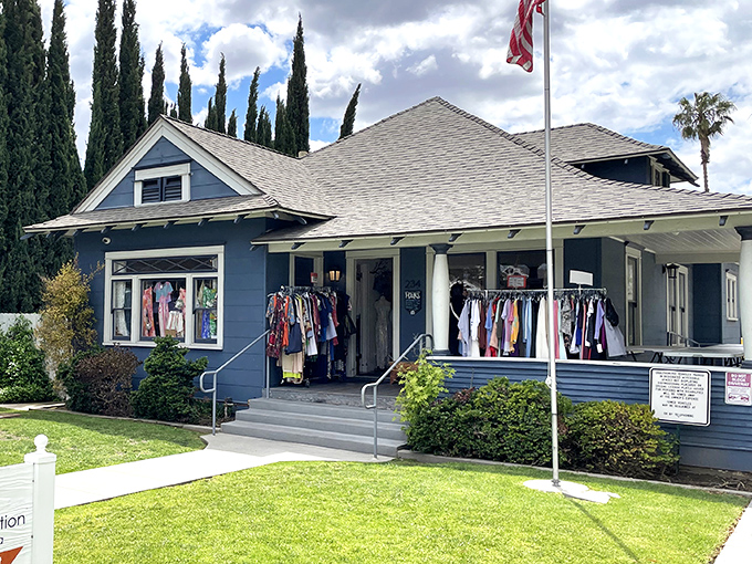 The charming blue craftsman house doesn't scream "thrift store" so much as "your stylish friend's home who happens to sell her amazing clothes."