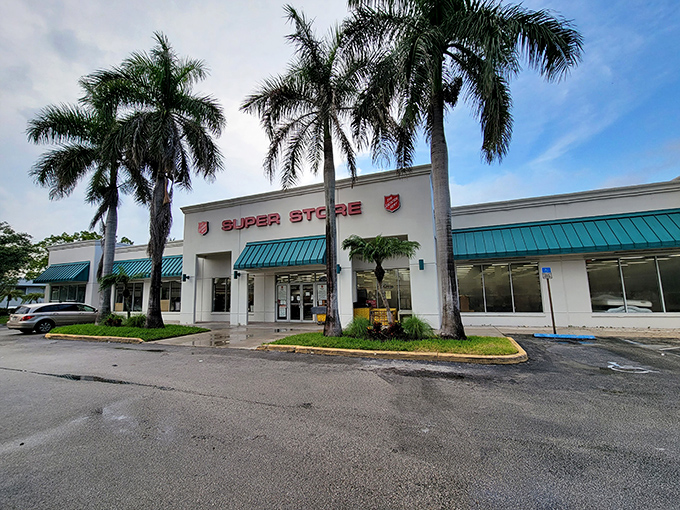 The iconic red shield welcomes treasure hunters under swaying Florida palms &ndash; a thrifter's paradise disguised as an unassuming storefront.
