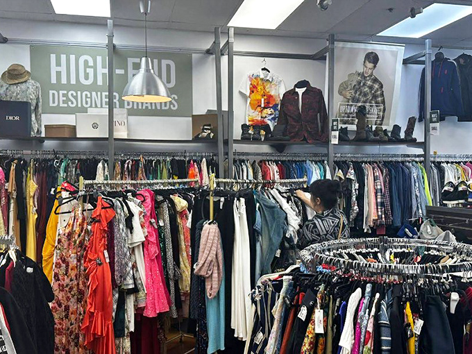 The beige storefront of Uptown Cheapskate stands ready to welcome bargain hunters with its clean lines and inviting entrance.
