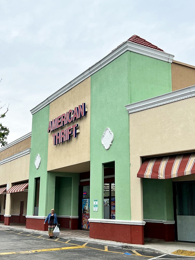 The mint-green facade of American Thrift stands like a beacon of bargain hope against the Florida sky, promising treasures within those sliding doors.