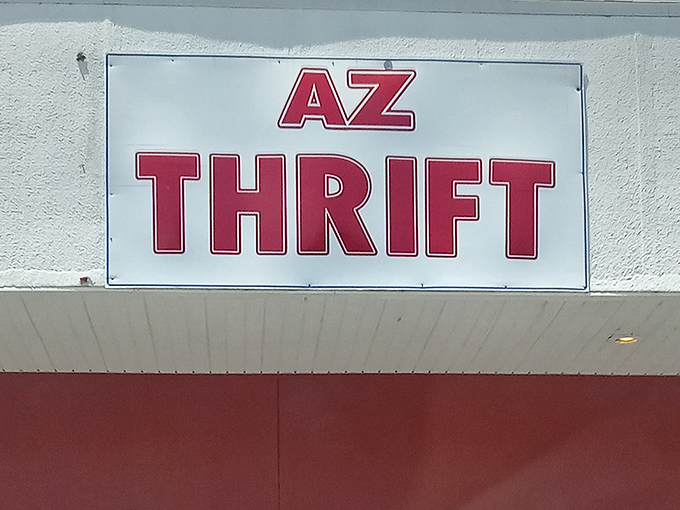The bold red signage of AZ Thrift beckons bargain hunters like a lighthouse guiding ships to treasure-filled shores.