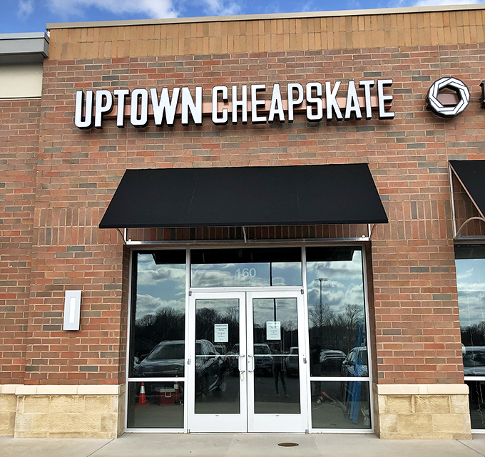 The brick facade of Uptown Cheapskate in Ellicott City promises treasure hunting without the usual thrift store treasure map. Fashion gold awaits inside!
