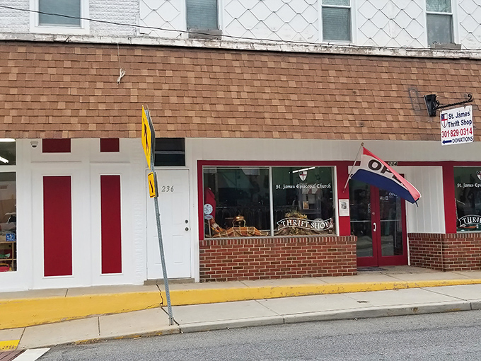 The unassuming storefront of St. James Thrift Shop beckons with its cheerful red door, proving that treasure hunting doesn't require a passport or Indiana Jones hat.