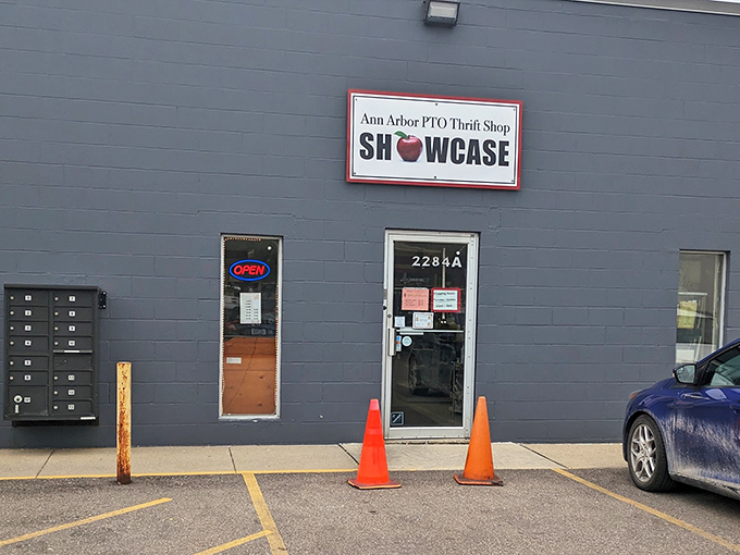 The unassuming gray exterior with its bright red-framed apple logo promises treasures within—like finding a diamond mine disguised as a garden shed.