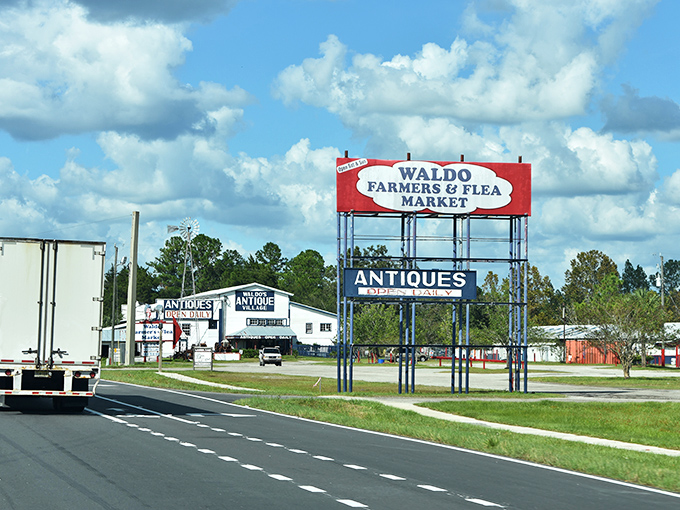 The iconic red and white sign beckons treasure hunters like a lighthouse for bargain sailors. Welcome to Waldo, where adventures begin at the roadside.