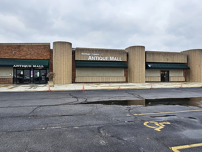 The unassuming exterior of Heritage Square Antique Mall hides a universe of treasures within, like a time-travel portal disguised as a strip mall storefront.